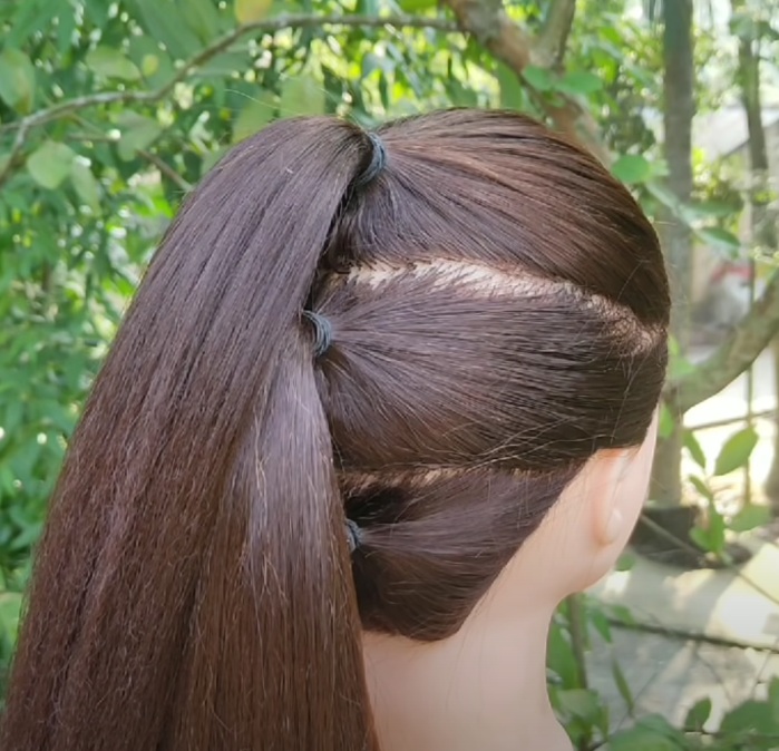 Woman shows how easy it is to do an elegant French bun