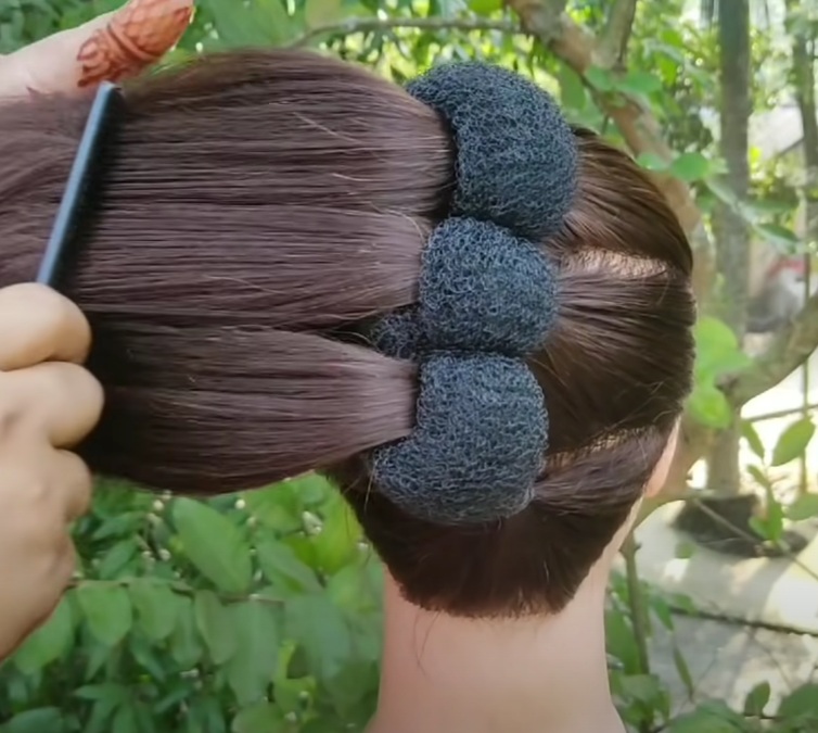 Woman shows how easy it is to do an elegant French bun