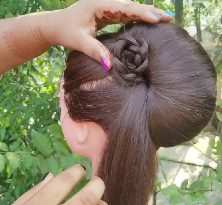Woman shows how easy it is to do an elegant French bun